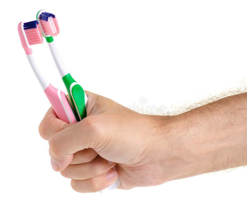 Two toothbrushes in hand stock image. Image of blue - 119986909