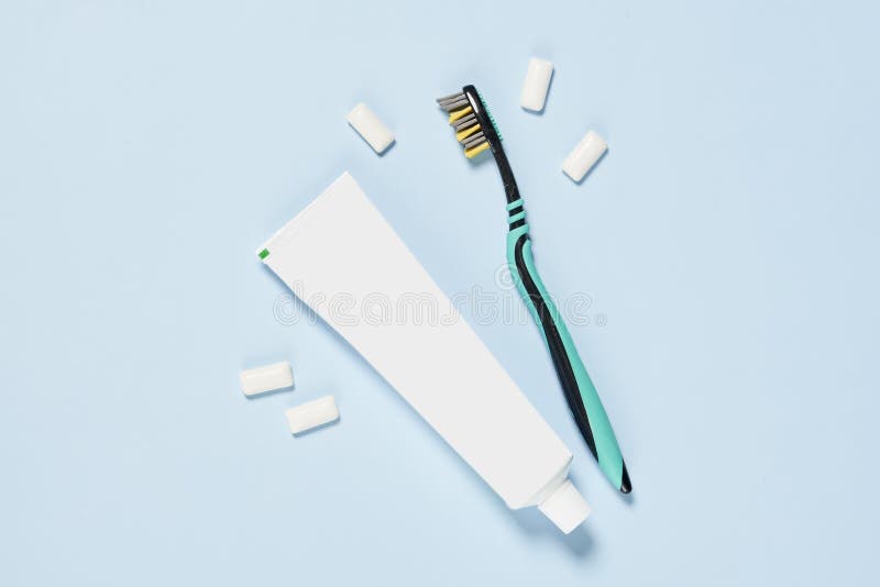 Two Toothbrushes and Toothpaste on a Paper Stock Image - Image of ...