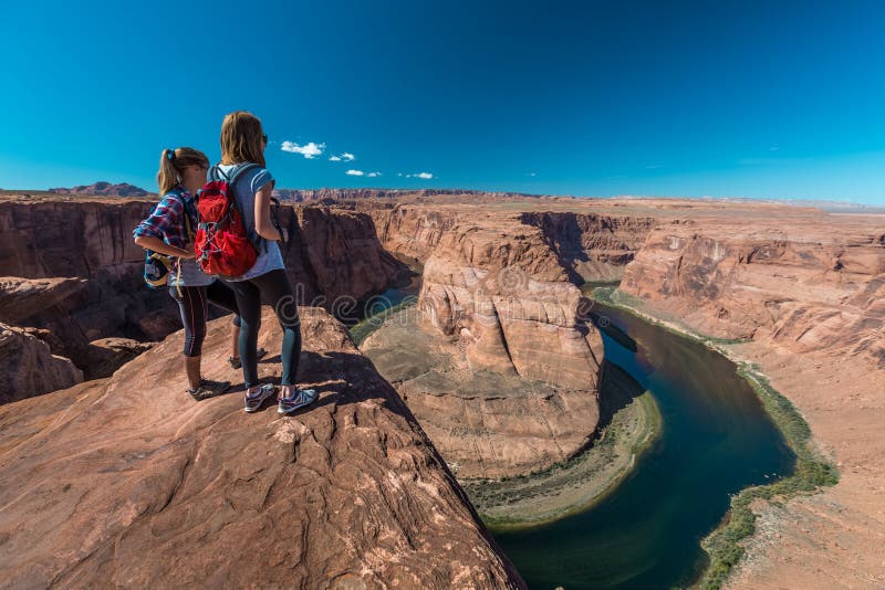 Two Tourist Enjoy Colorado River Stock Image - Image of hikers, rock ...