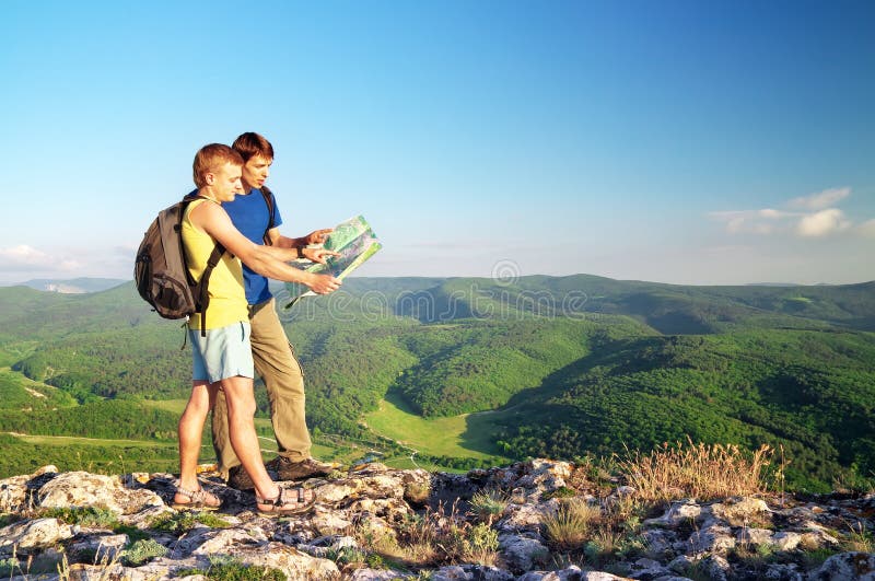 Two Tourists in Mountain Read the Map. Stock Image - Image of grass ...