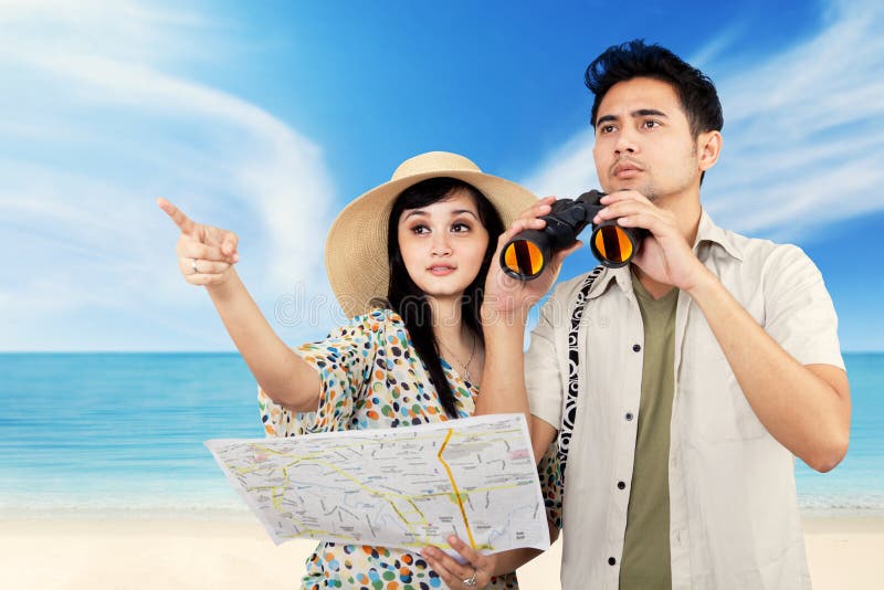 Two Tourists Sightseeing at Beach Stock Image - Image of cloud ...