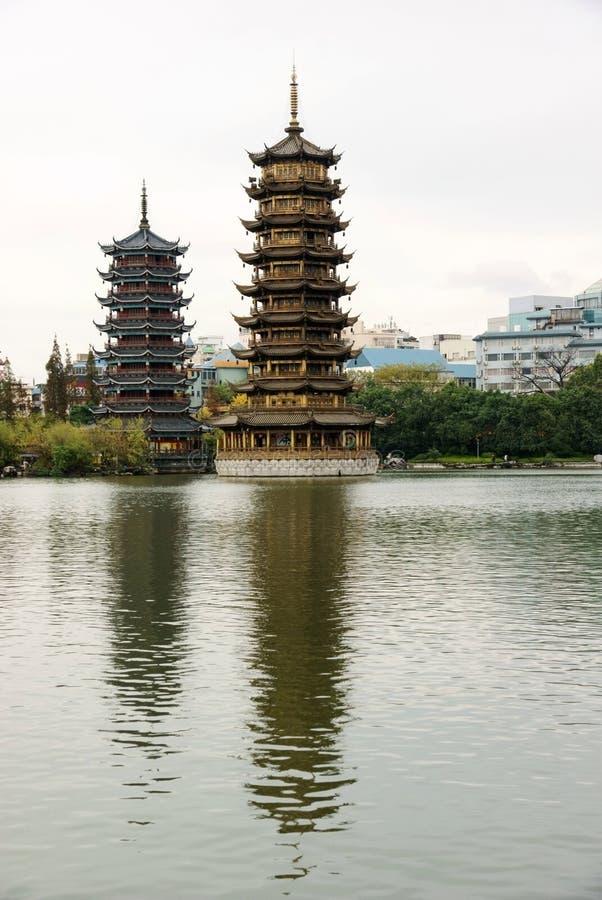 Two towers in lake stock image. Image of guilin, urban - 17517355