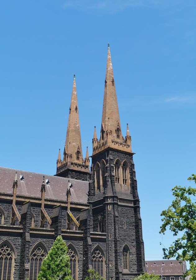 Two Towers with Spires Opposite a Blue Sky Stock Image - Image of tower ...
