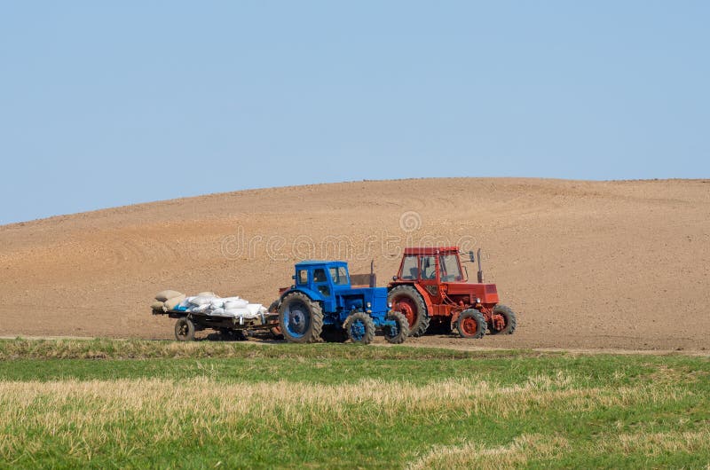 Two tractors stock photo. Image of cultivator, color - 52762030