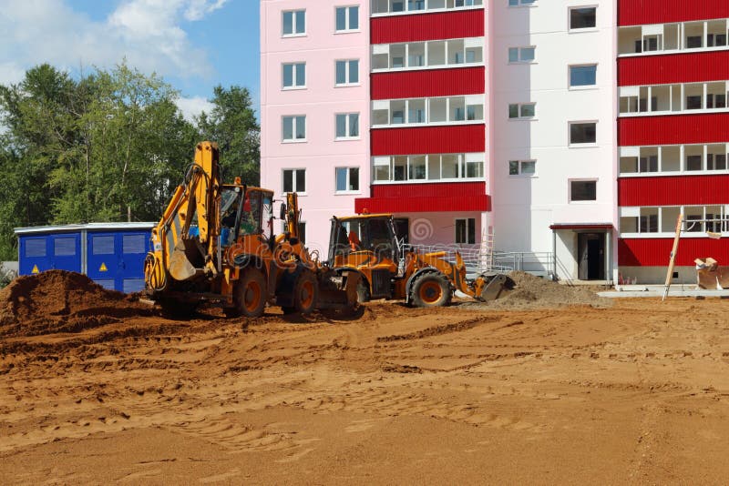 Two Tractors Work on Construction Site at Summer Sunny D Stock Photo ...