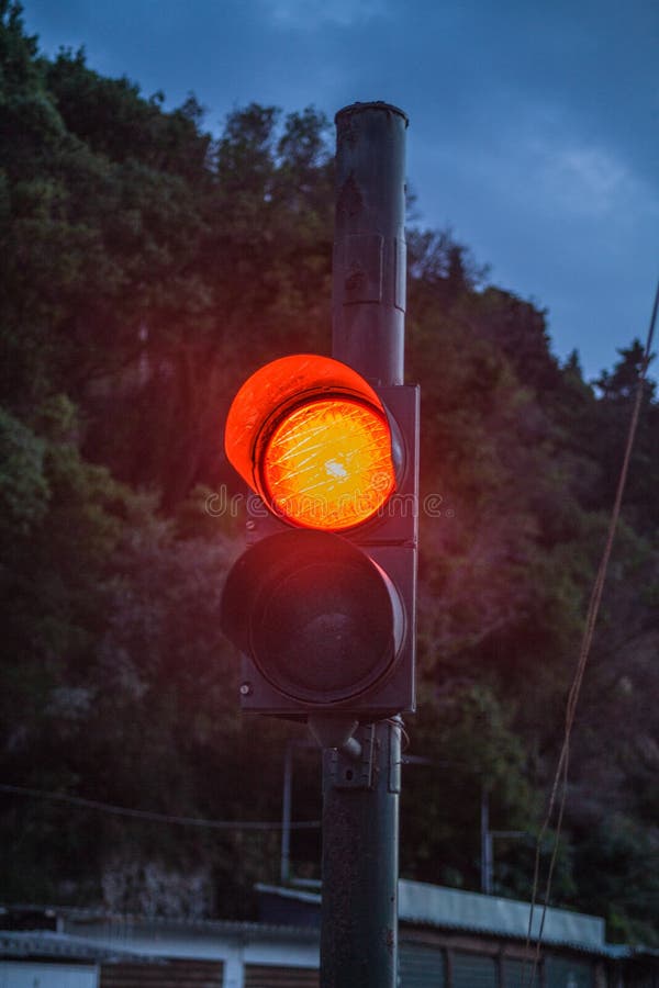 Two Traffic Light One is Lighted in Orange Signalling. Verdant Cliff ...