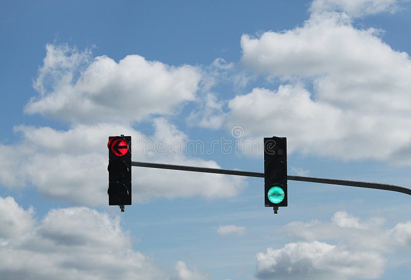 Two Traffic Lights One Red To the Left Side and One Green Light To ...