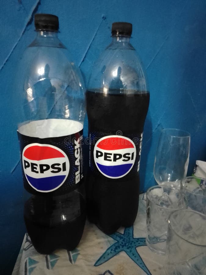 Two Transparent Plastic Bottles with Brand Label and Liquid Inside with ...