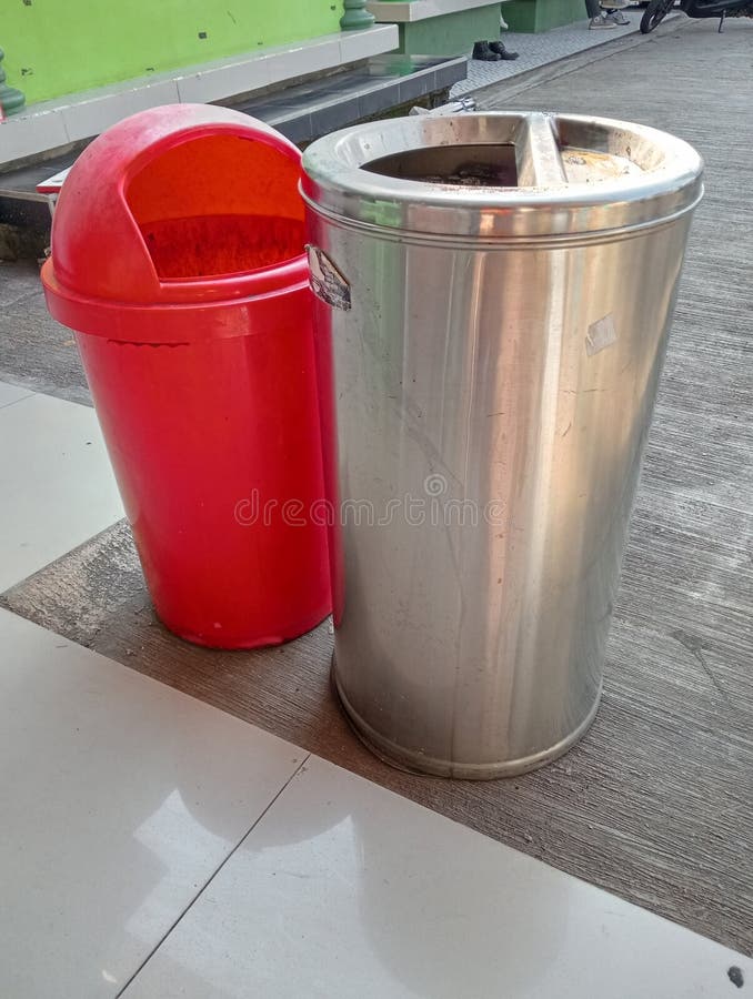 Two Trash Cans in a Row, One Red and One Silver Stock Photo - Image of ...