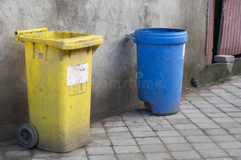 Two Trash Cans are Sitting on a Brick Walkway Stock Image - Image of ...