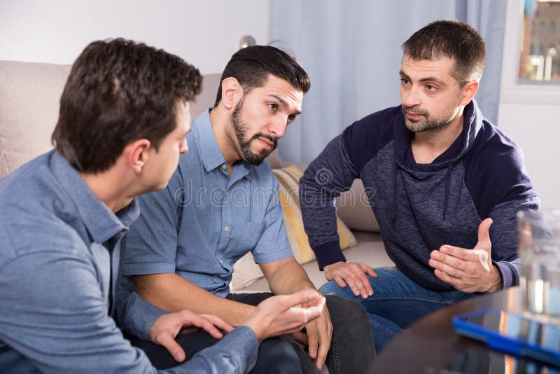 Two Troubled Men Talking with Friend Stock Image - Image of offended ...