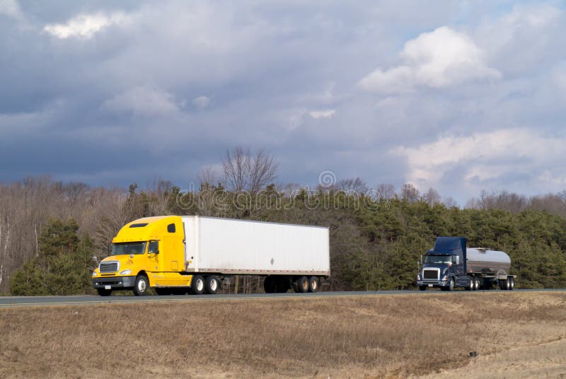 Two trucks on highway stock photo. Image of transporter - 23734154