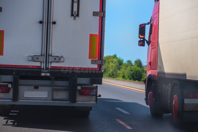Two trucks on the highway stock image. Image of lorry - 141363519