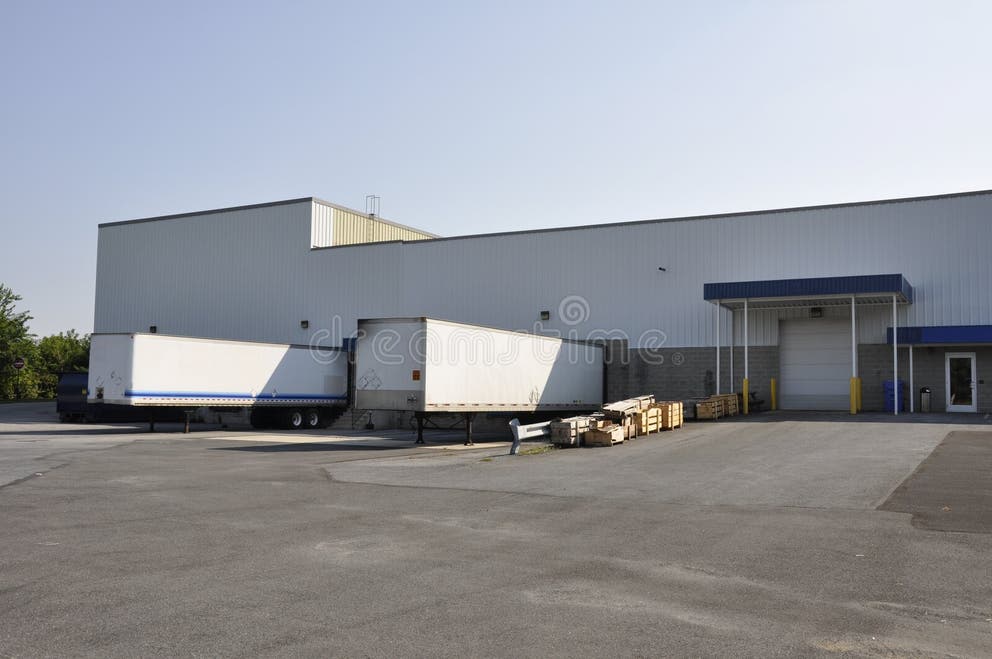 Two Trucks at Unloading Dock Stock Photo - Image of bays, workplace ...