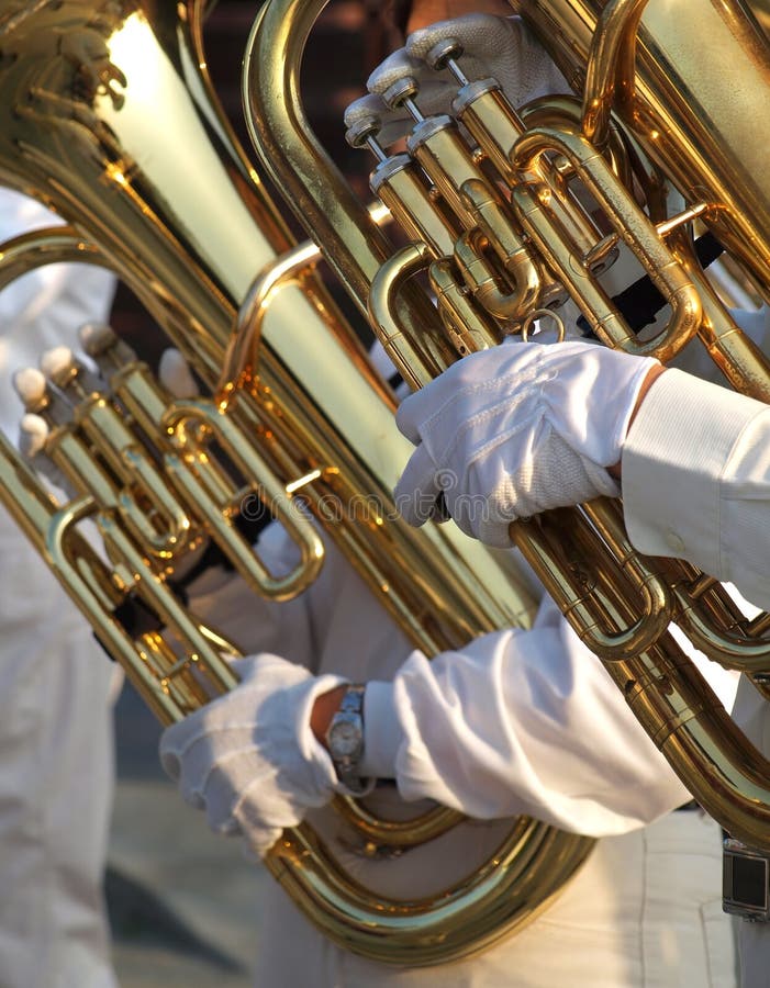 Two Tuba Players stock image. Image of fingers, reflection - 23272483