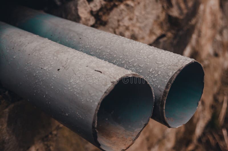 Two Tubes in a Hole of the Wall Stock Photo - Image of garden, connect ...