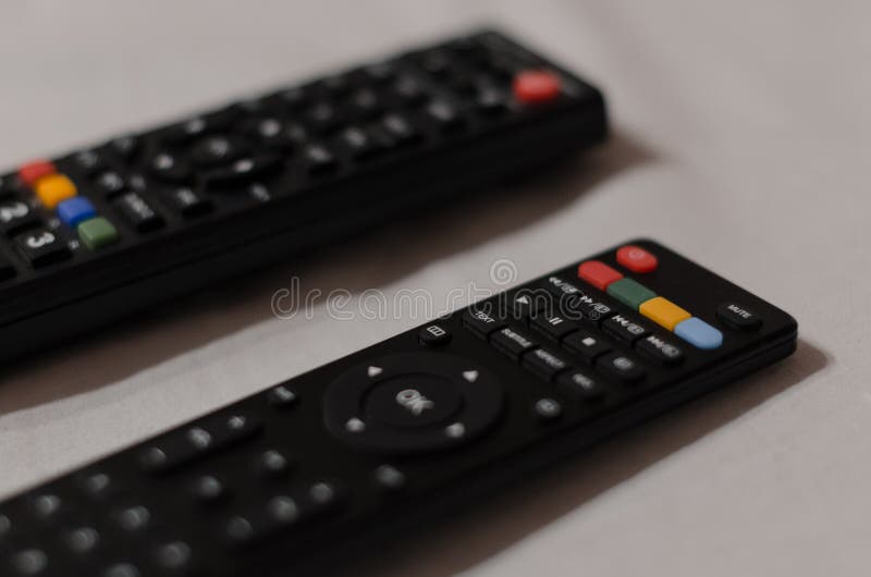 Two TV remote controllers stock photo. Image of background - 140081456