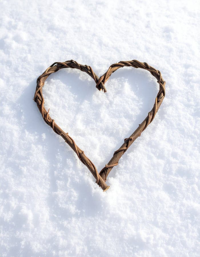 Two Twigs Intertwined into the Shape of a Heart Resting on the Surface ...