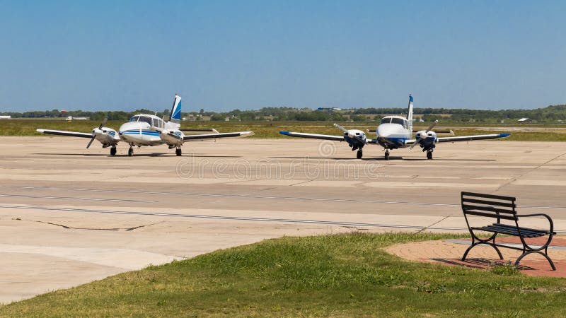 Two Twin Engine Planes at an Airfield Editorial Stock Image - Image of ...