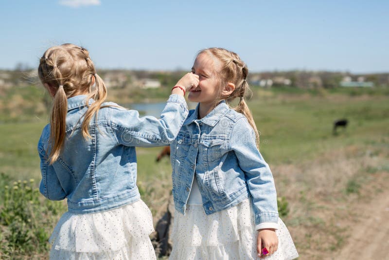 Two Twin Sisters Have Fun and Play for Example Stock Image - Image of ...