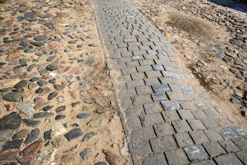 Two Types of Paving Stones and Cobblestones on a City Road Stock Photo ...