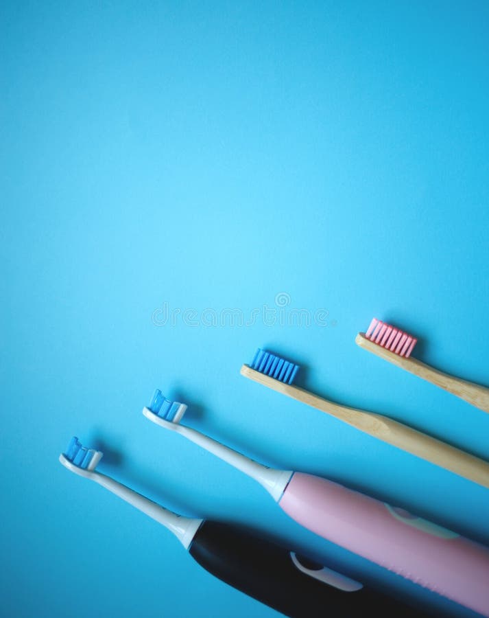 Two Ultrasonic Electric Toothbrushes on a Blue Background Stock Image ...
