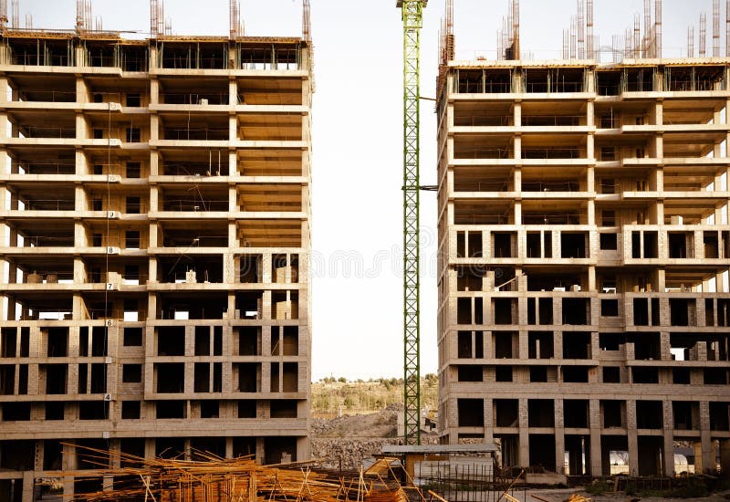 Unfinished High-rise Buildings Under Construction with a Crane in ...