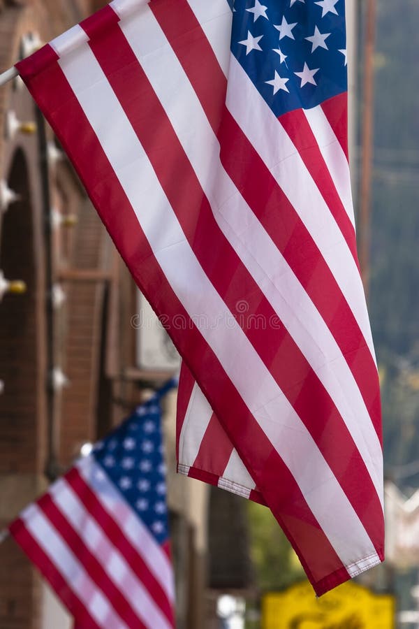 Two USA flags in a street stock photo. Image of white - 17548486