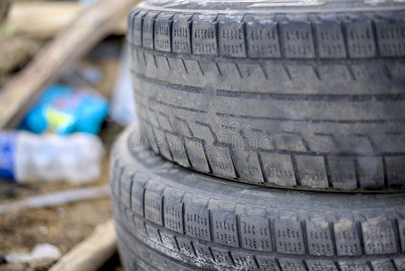 Two Used Tires Stacked on the Ground Stock Image - Image of tire, white ...