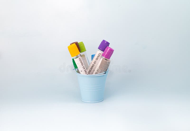 Two Vacuum Tubes for Collection and Blood Samples in Bucket on Blue ...