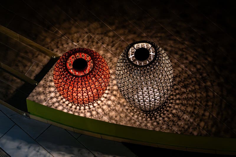 Two Vases with a Light Inside of Them are on a Green Table Stock Image ...