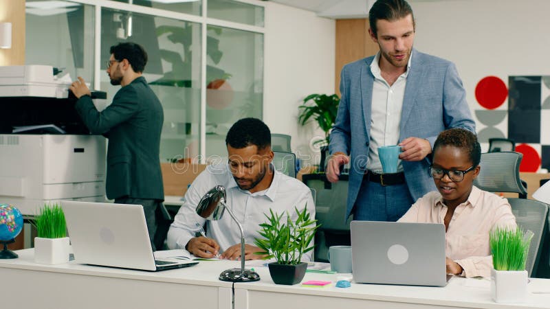 Two Very Good Looking Co- Workers are in the Office, Having a ...