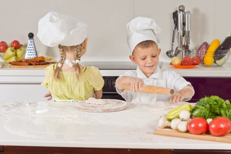 Two Very Young Chefs Making Food while Talking Stock Image - Image of ...