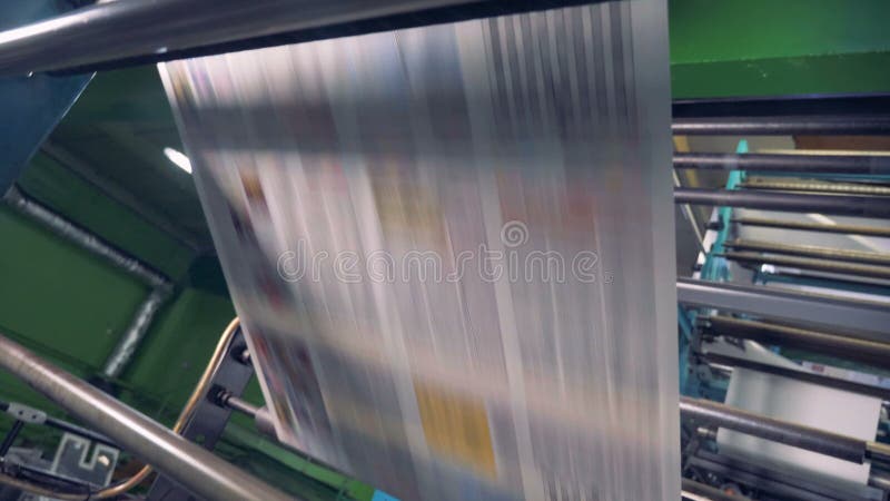 Two Views of a Whole Massif of Printed Paper Sheets Getting Processed ...
