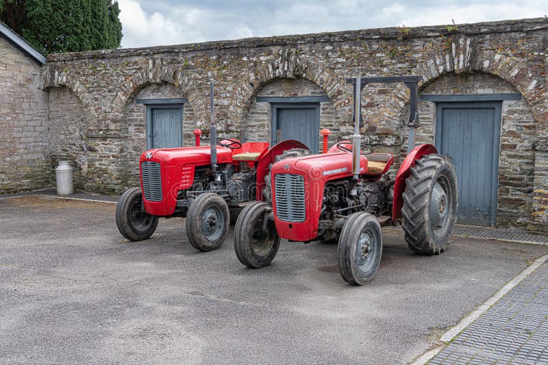 Two Vintage Tractor Engines in a Courtyard Stock Photo - Image of ...