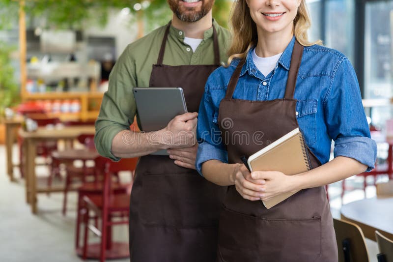 Two Waiters in Pizzeria Looking Happy and Confident Wile Waiting for ...