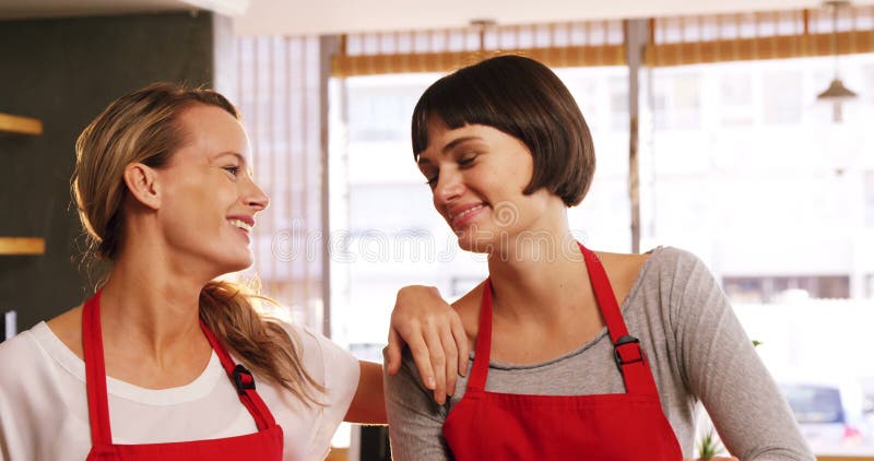 Two Waitresses Standing Together in Cafe Stock Video - Video of filming ...