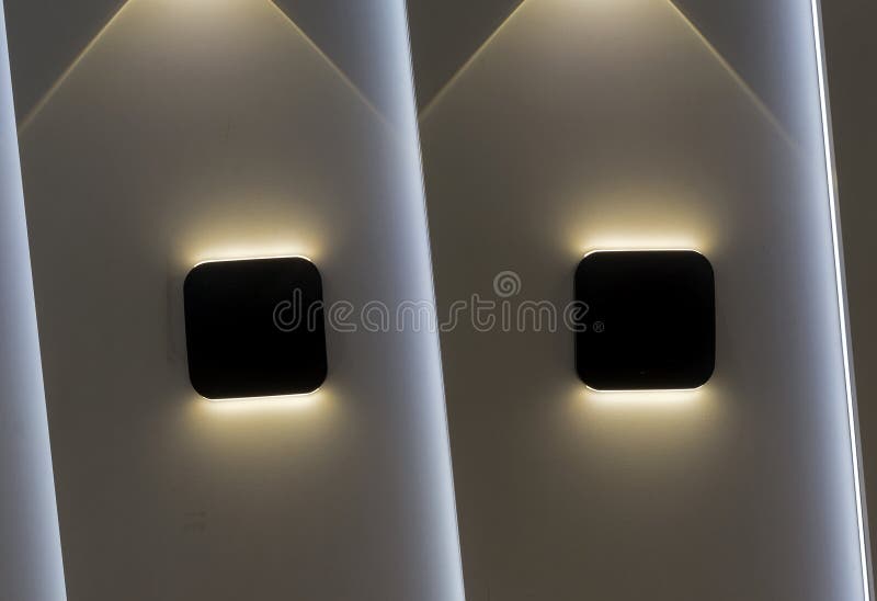 Two Wall Lights with Symmetrical Highlights on the Wall. Stock Photo ...