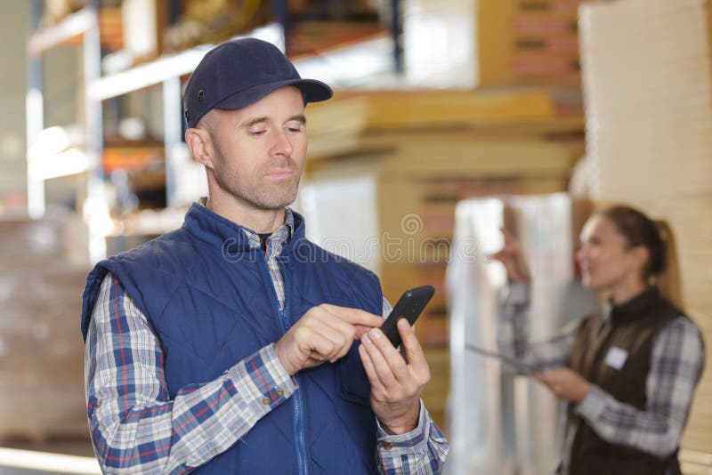 The two warehouse workers stock image. Image of workers - 258796361