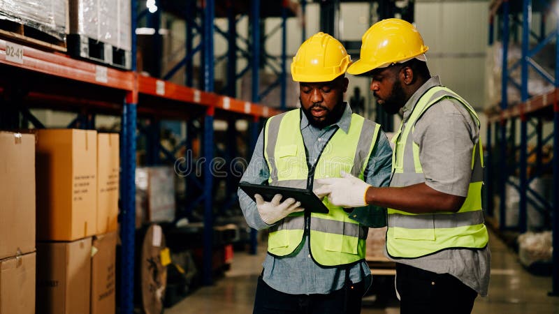 Two Warehouse Workers with Safety Helmet Working at Factory Stock Image ...
