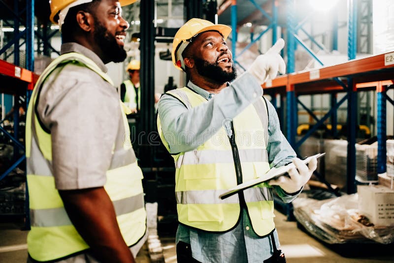 Two Warehouse Workers Checking and Controlling Boxes in Warehouse Stock ...