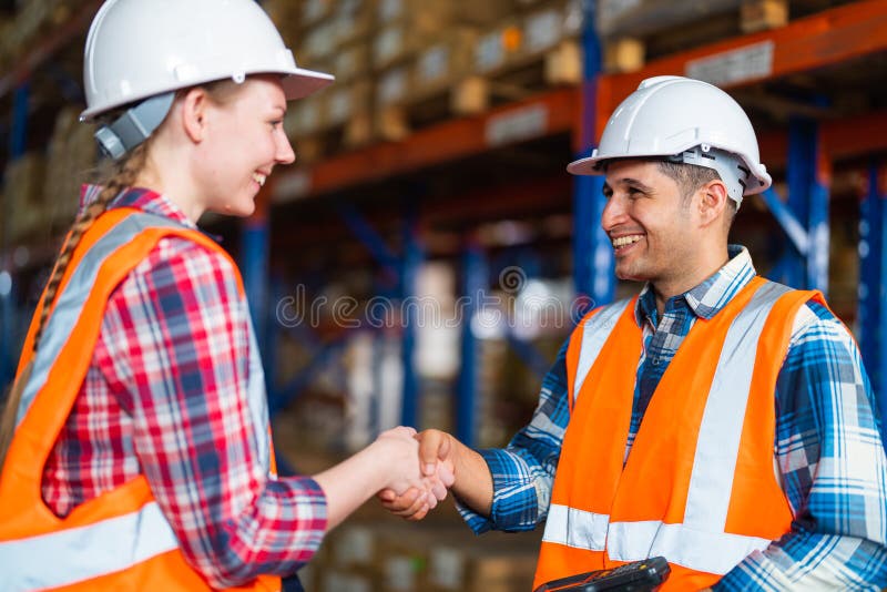 Two Warehouse Workers Shaking Hand when Success Project or First Time ...