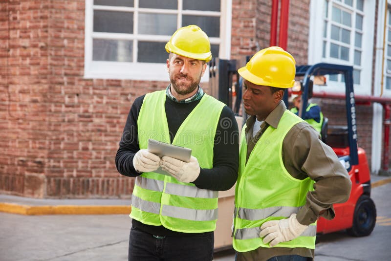 Two Warehouse Workers with Tablet Computer Stock Photo - Image of ...