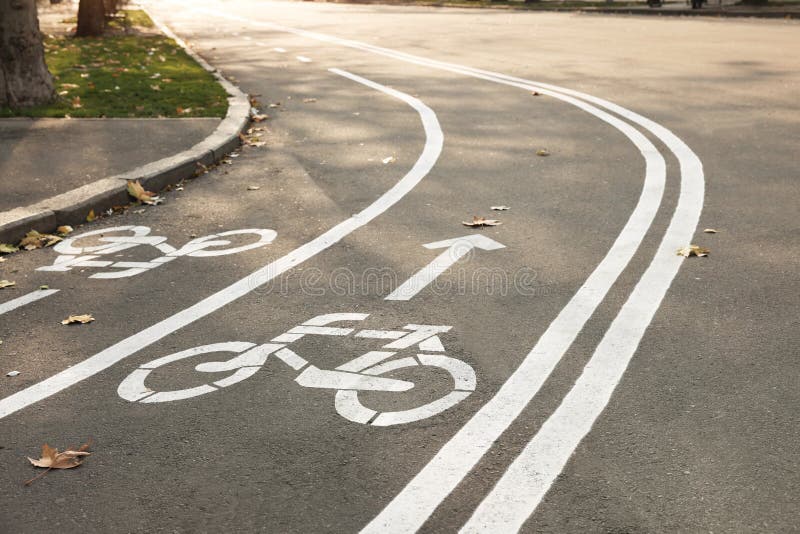 Two Way Bicycle Lane with White Signs on Asphalt Stock Photo - Image of ...