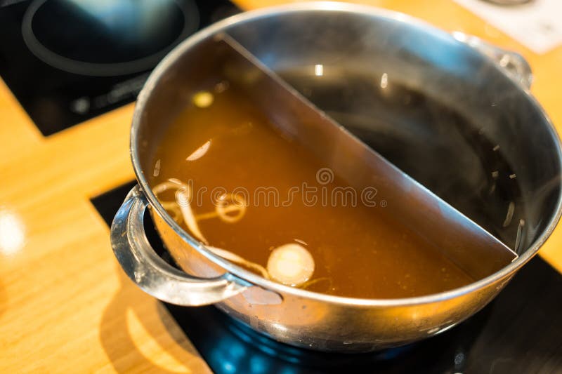 Two Ways Soup in on Pot for Shabu Shabu Stock Photo - Image of bowl ...