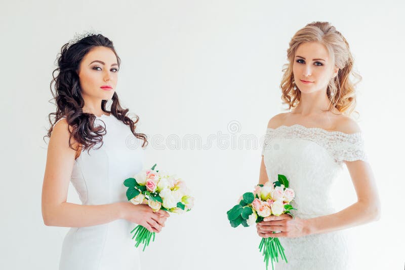 Two Wedding Bride with Bouquet Wedding Hairstyle Stock Image - Image of ...