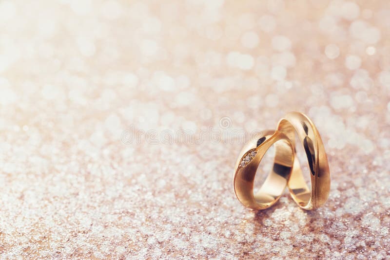 Two Wedding Rings on Abstract Background with Copy Space Stock Image ...