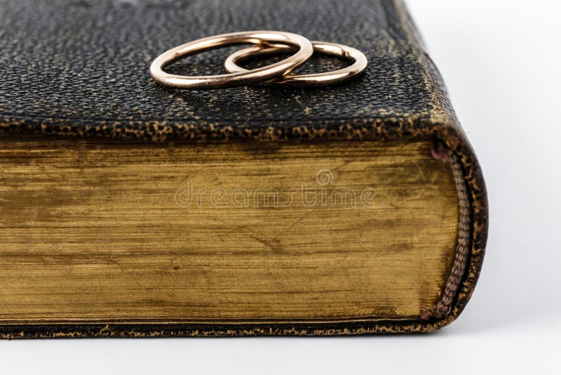 Two Wedding Rings on a Bible Stock Photo - Image of close, circle ...