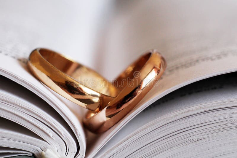 Two Wedding Rings and a Book so Close Stock Image - Image of meaning ...