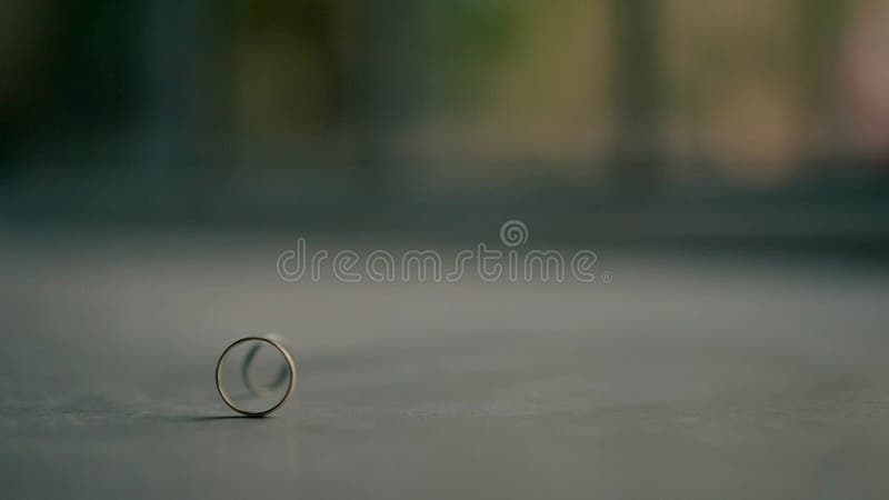 Two Wedding Rings on the Empty Table. a Stationary Ring and a Rotating ...